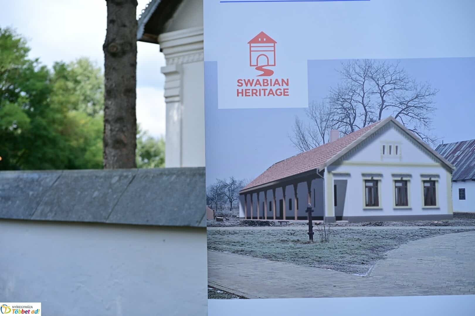 A present rooted in the past: a decorative barn and a residential house ...